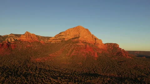 Aerial flying backwards over red rocks a... | Stock Video | Pond5