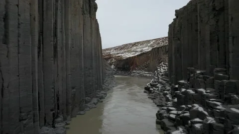 Aerial: Flying between basalt columns in... | Stock Video | Pond5