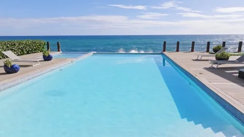 Aerial flyover infinity swimming pool in... | Stock Video | Pond5