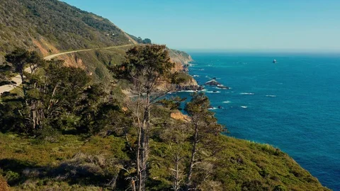 Aerial forward dolly shot above trees to... | Stock Video | Pond5