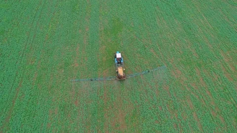Aerial high angle shot of a tractor mach... | Stock Video | Pond5