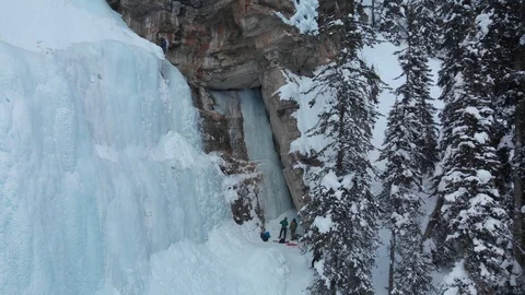 Aerial of Ice Climbers Climbing a Frozen... | Stock Video | Pond5