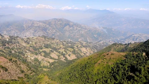Aerial: Layers of mountains covered with... | Stock Video | Pond5