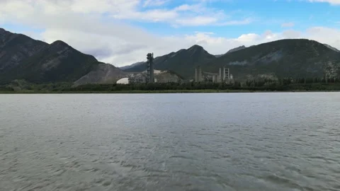 Aerial long approach to the Exshaw indus... | Stock Video | Pond5