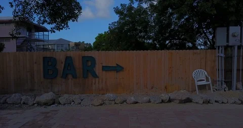 AERIAL: moving past a bar sign and lifti... | Stock Video | Pond5