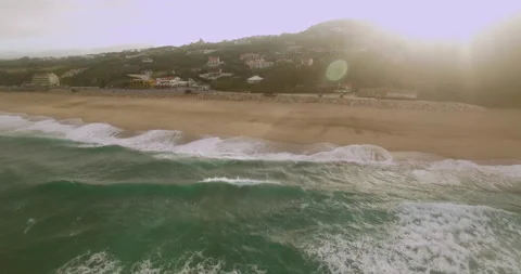 Aerial of ocean waves flowing to beach w... | Stock Video | Pond5