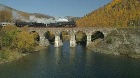 Aerial old steam locomotive train rides ... | Stock Video | Pond5