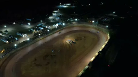 Aerial orbit of race car racing on oval ... | Stock Video | Pond5