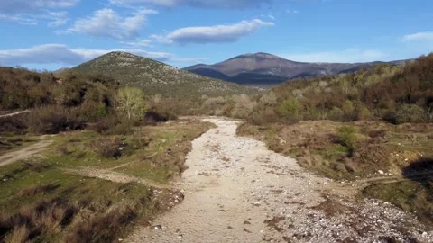 Aerial over dry river with empty river b... | Stock Video | Pond5
