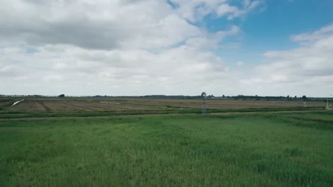 Aerial over the Dutch flat countryside b... | Stock Video | Pond5