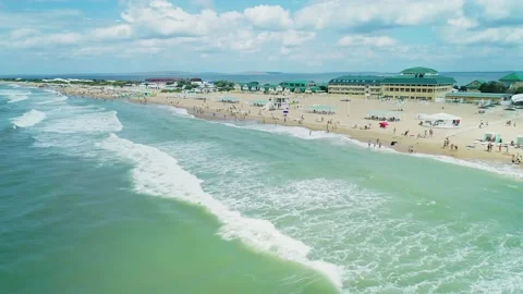Aerial over the long sandy spit with a b... | Stock Video | Pond5