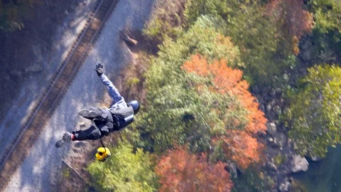 Aerial Overhead, Man Base Jumping and Pu... | Stock Video | Pond5