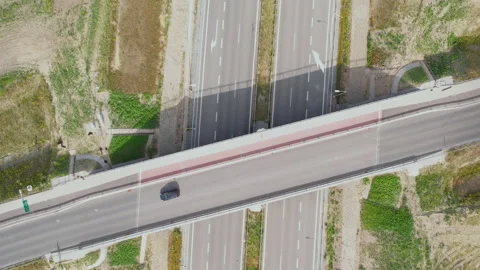 Aerial overhead shot of car crossing bri... | Stock Video | Pond5