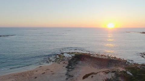 Aerial pan across ocean beach facing the... | Stock Video | Pond5