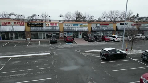 Aerial Pan tracing shot store fronts- st... | Stock Video | Pond5