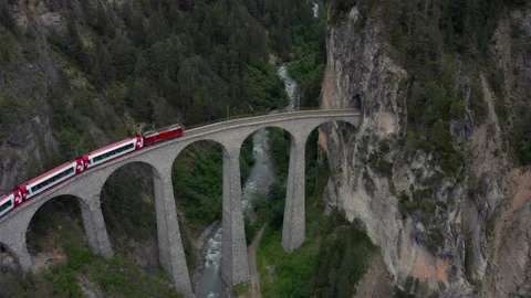 Aerial panorama of Swiss red train on fa... | Stock Video | Pond5