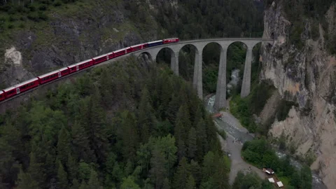 Aerial panorama of Swiss red train on fa... | Stock Video | Pond5