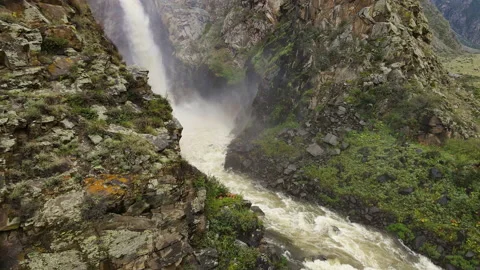 Aerial: A powerful stream of water falls... | Stock Video | Pond5