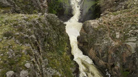 Aerial: A powerful stream of water falls... | Stock Video | Pond5