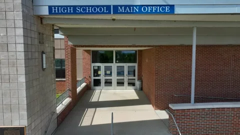 Aerial push in of main office entrance a... | Stock Video | Pond5