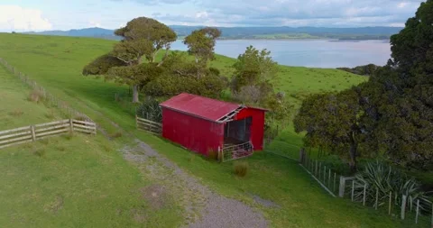Aerial: Red barn on farmland, Auckland, ... | Stock Video | Pond5