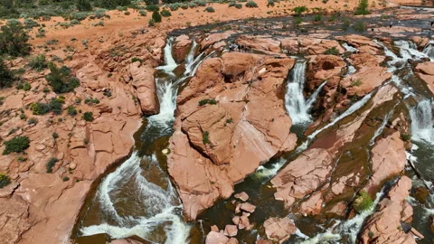Aerial red rock canyon waterfalls Utah d... | Stock Video | Pond5