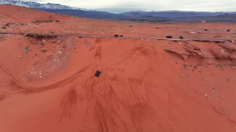 Aerial red rock sand cliff off road vehi... | Stock Video | Pond5
