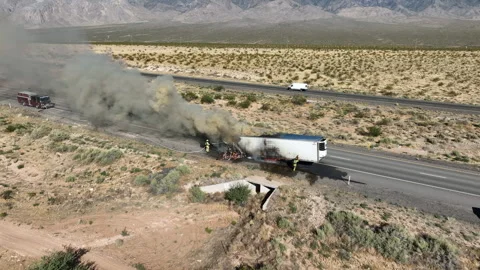 Aerial semi truck trailer fire highway f... | Stock Video | Pond5