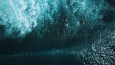 Aerial shot above a huge wave crashing i... | Stock Video | Pond5