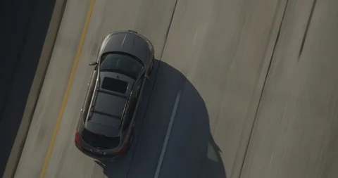 Aerial shot, day zoom in on car driving ... | Stock Video | Pond5