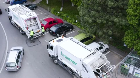 Aerial shot of garbage men with trash tr... | Stock Video | Pond5