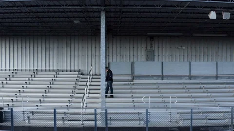 Aerial shot of retired coach walking on ... | Stock Video | Pond5