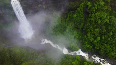 Aerial shot of a scenic waterfall flowin... | Stock Video | Pond5