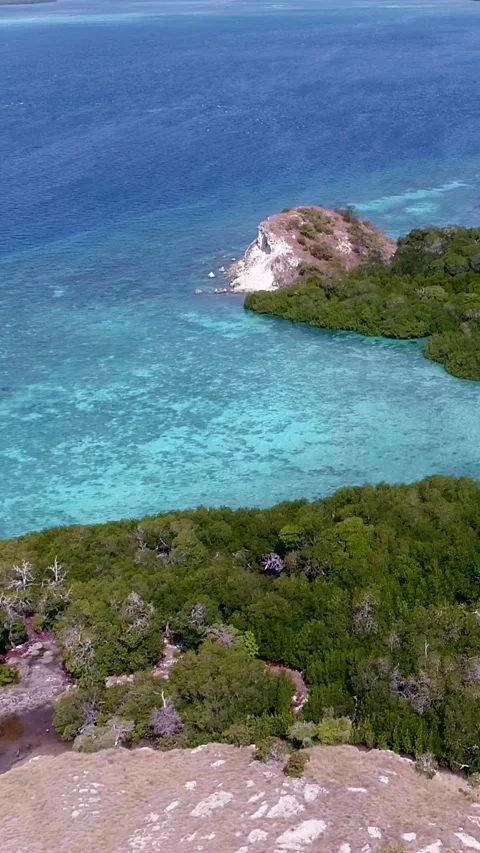Aerial shot of small sandy bay surrounde... | Stock Video | Pond5