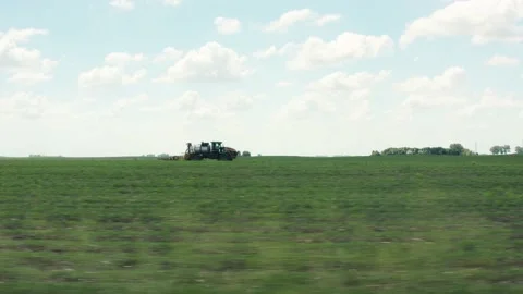 Aerial side view, tractor driving fast s... | Stock Video | Pond5
