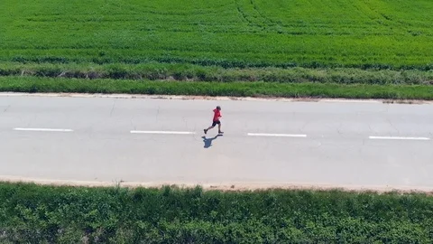 Aerial slow motion: drone tracking man r... | Stock Video | Pond5