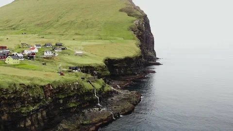 Aerial of small village along the cliffs... | Stock Video | Pond5