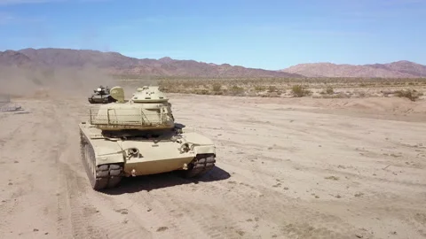 Aerial of Three Tanks Driving in a Deser... | Stock Video | Pond5