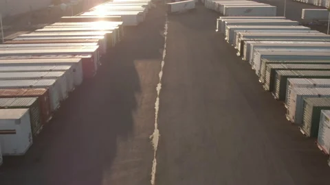 Aerial Tilt Above a Lot Lined with Shipp... | Stock Video | Pond5