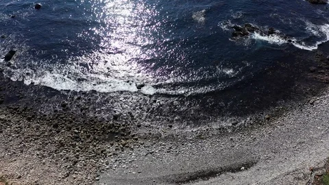 Aerial Tilt Up, Sunshine reflection on o... | Stock Video | Pond5