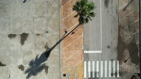 Aerial top down of a man walking on a cr... | Stock Video | Pond5