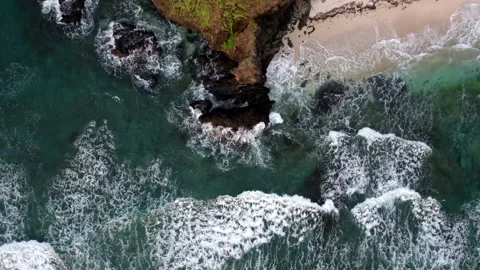 Aerial top down of ocean waves crashing ... | Stock Video | Pond5
