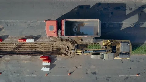 Aerial top down view of excavator loadin... | Stock Video | Pond5