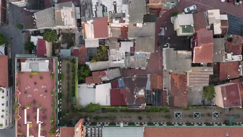 Aerial top down view of the slums next t... | Stock Video | Pond5