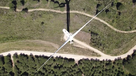 Aerial top down view, spinning wind turb... | Stock Video | Pond5