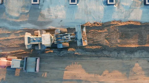 Aerial top view of backhoe loader and as... | Stock Video | Pond5