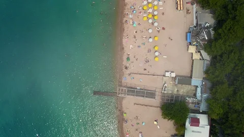 Aerial: top view of the beach. People ba... | Stock Video | Pond5