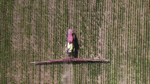 aerial top view red tractor sprayer work... | Stock Video | Pond5