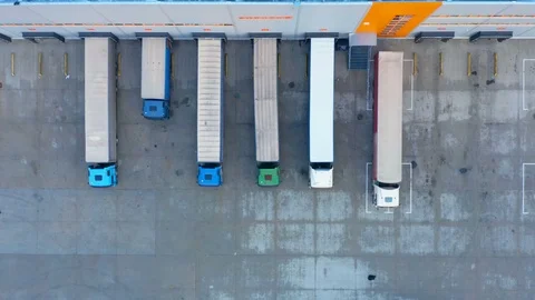 Aerial top view of semi-trailers trucks ... | Stock Video | Pond5
