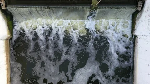 Aerial top view of small dam on the rive... | Stock Video | Pond5